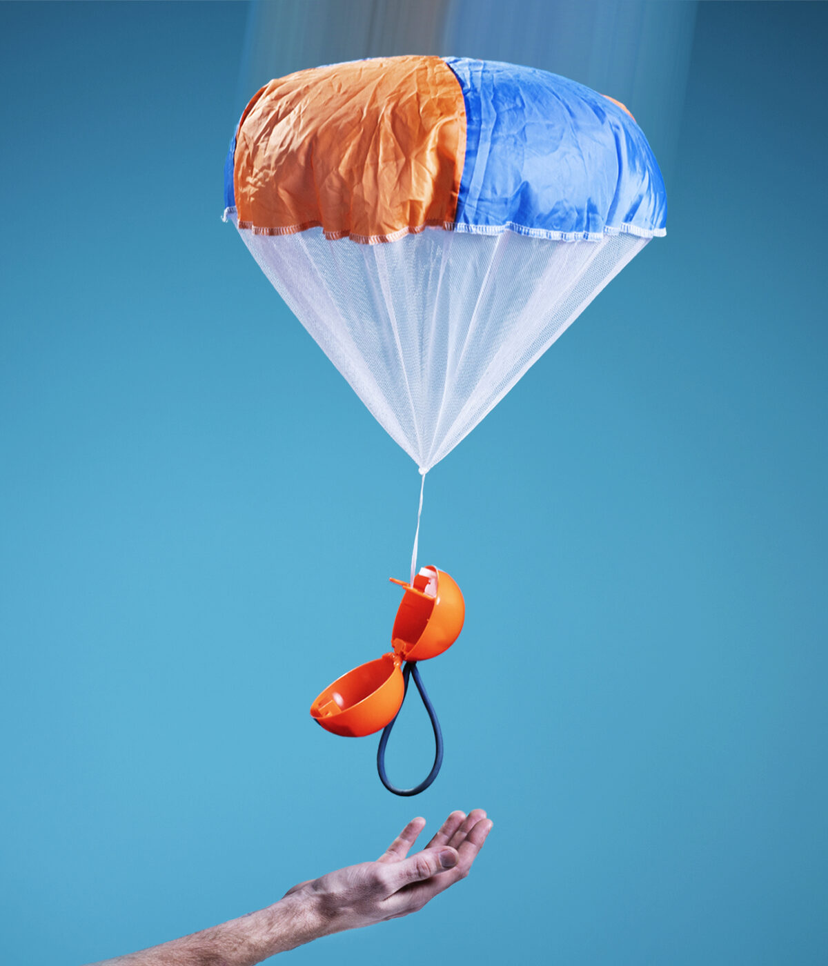 Parashoot: A ball-launching toy with a parachute inside!